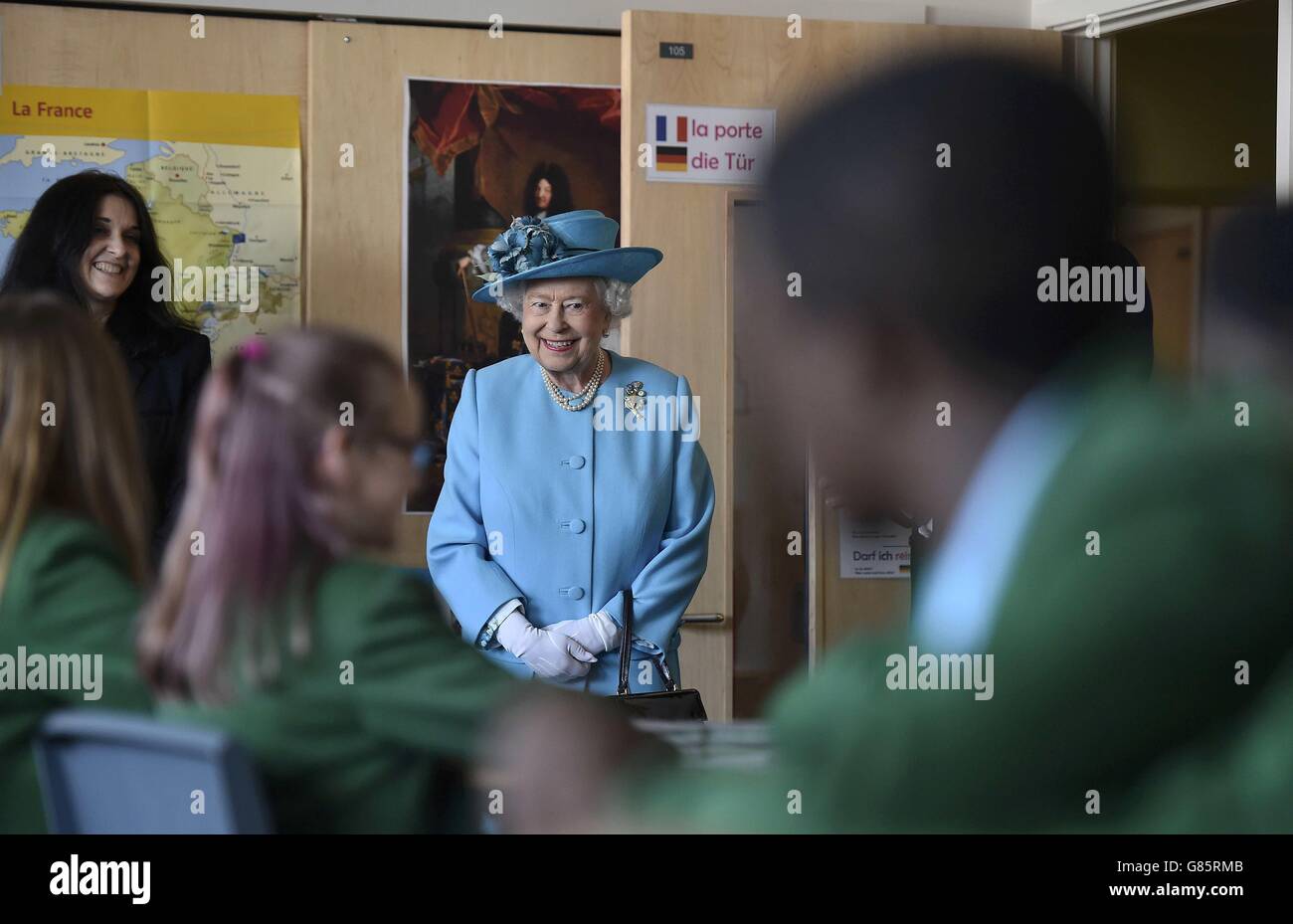 Queen Elizabeth II visits a class having a French lesson during a tour ...