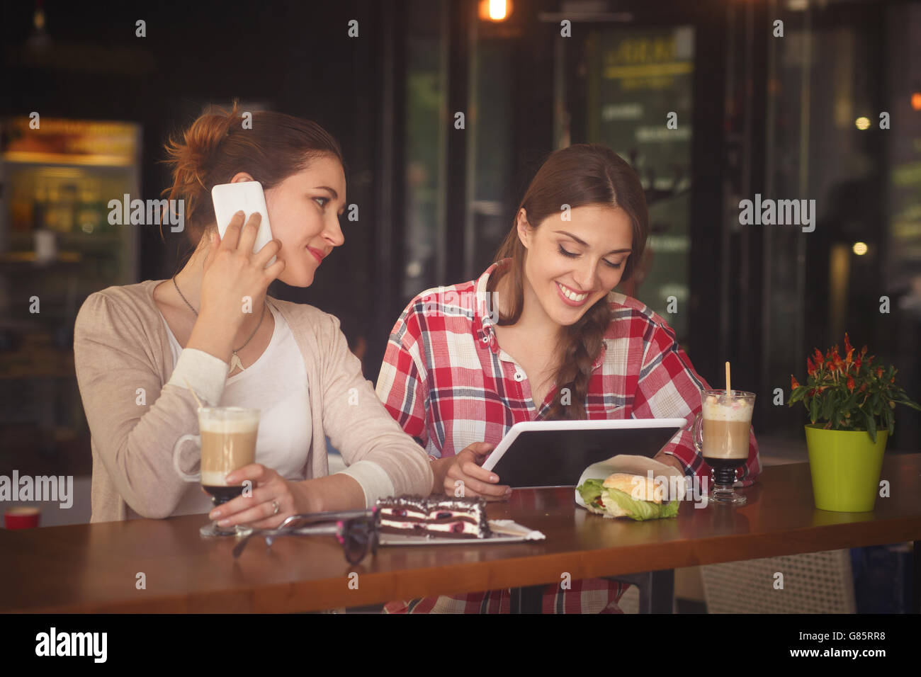 Best friends ladies in cafe Stock Photo - Alamy