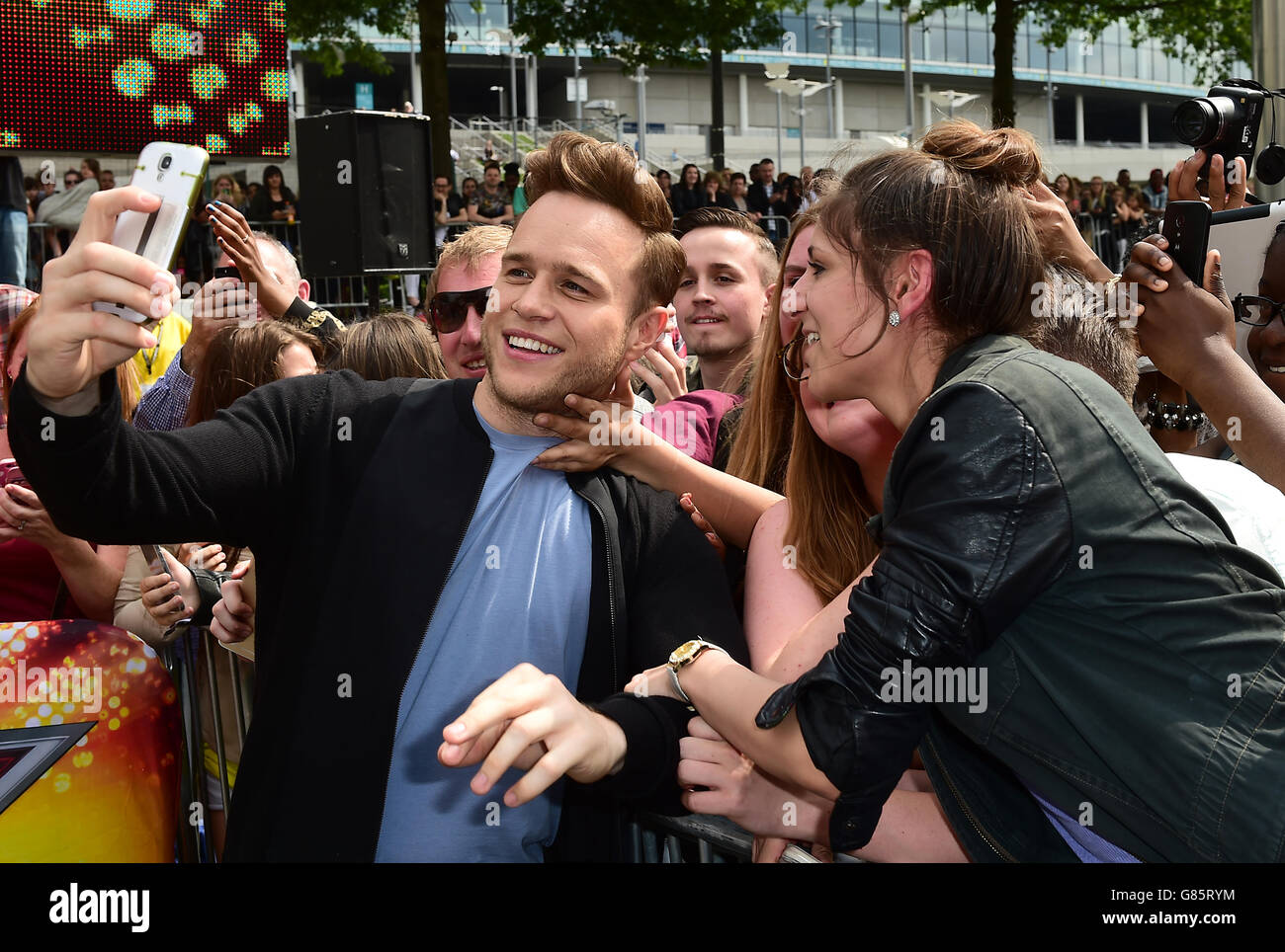Olly Murs poses with fans during the X Factor auditions held at Wembley ...