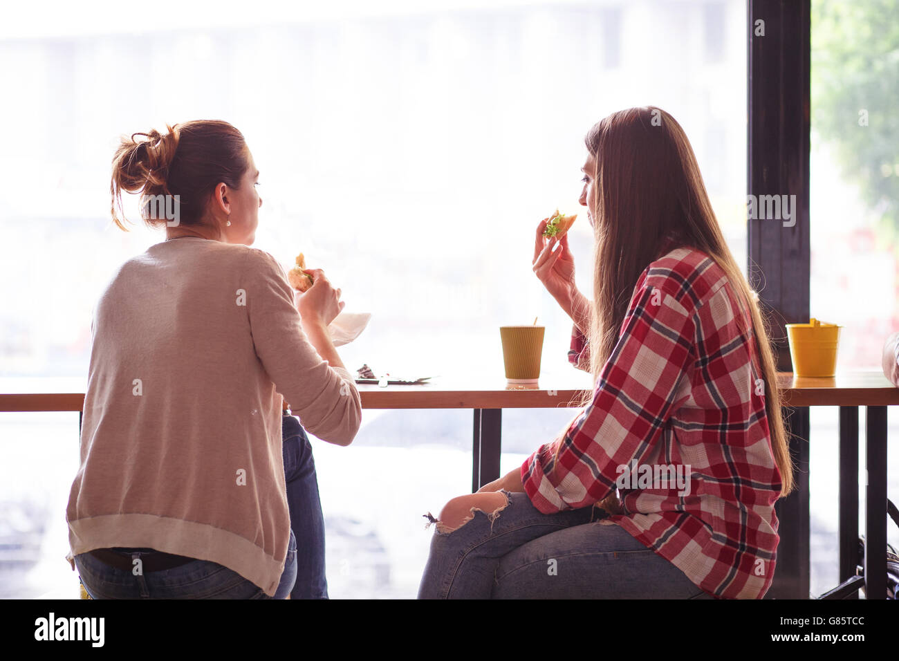 Best friends ladies in cafe Stock Photo - Alamy