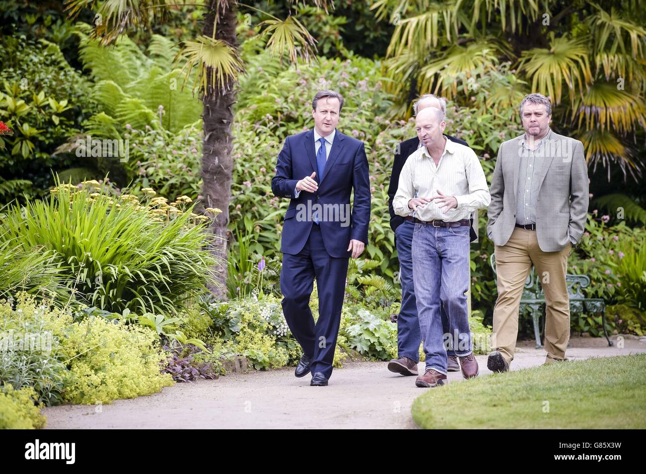 Prime Minister David Cameron (left)talks with head gardener Ian Davies ...