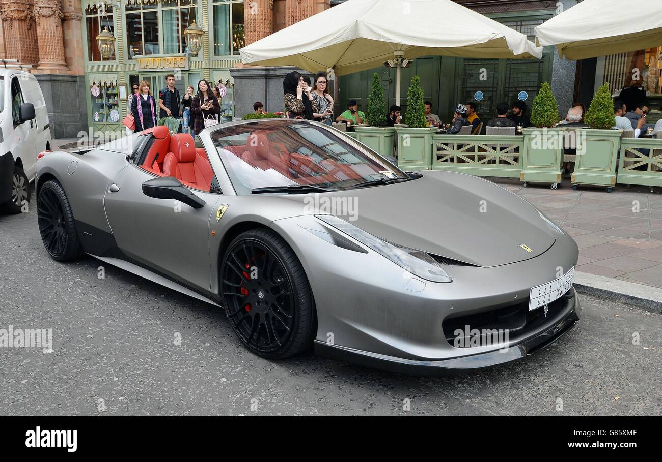 A Ferrari 458 Spyder a parking ticket on the windscreen, outside ...