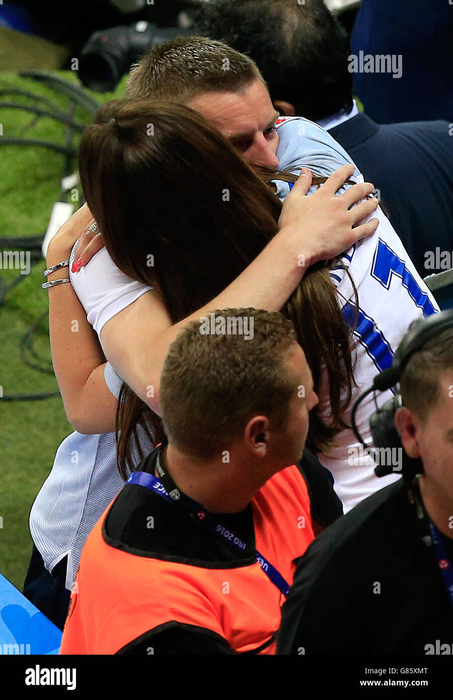 England's Jamie Vardy (centre) and wife Rebekah Vardy (right) after the ...