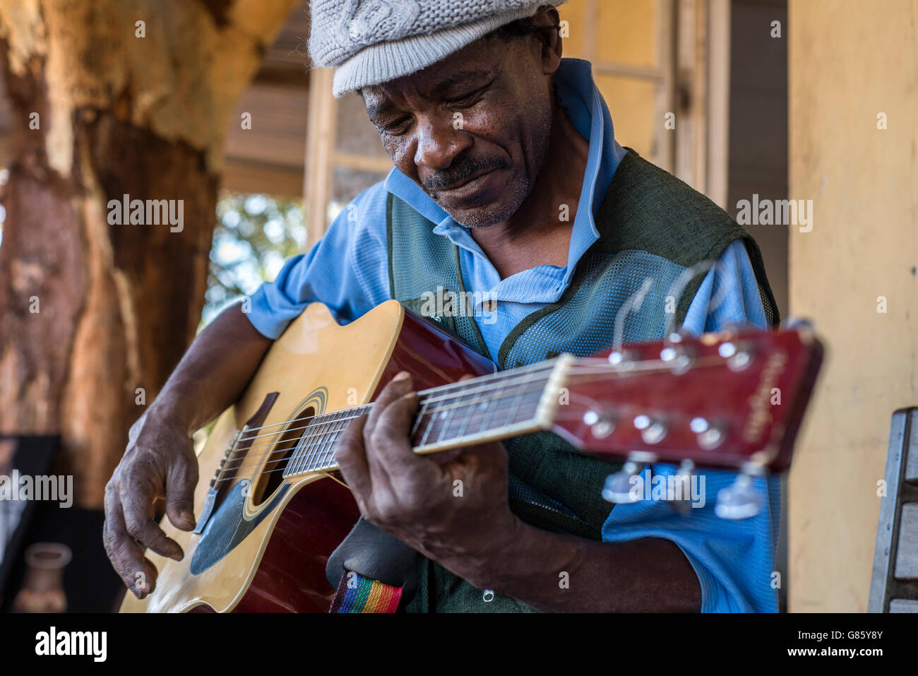 Coach Aaron Simfukwe plays reggae music at the Royal Livingstone golf ...