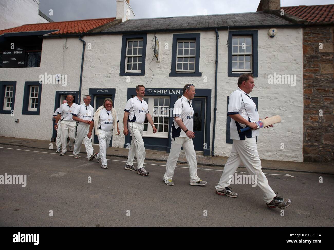Ship Inn cricket captain Graham Bucknall (right) leads his players out ...
