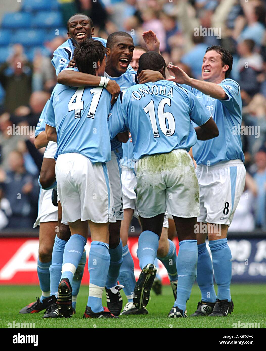 Manchester City's Sylvain Distin (c) celebrates scoring the opening ...