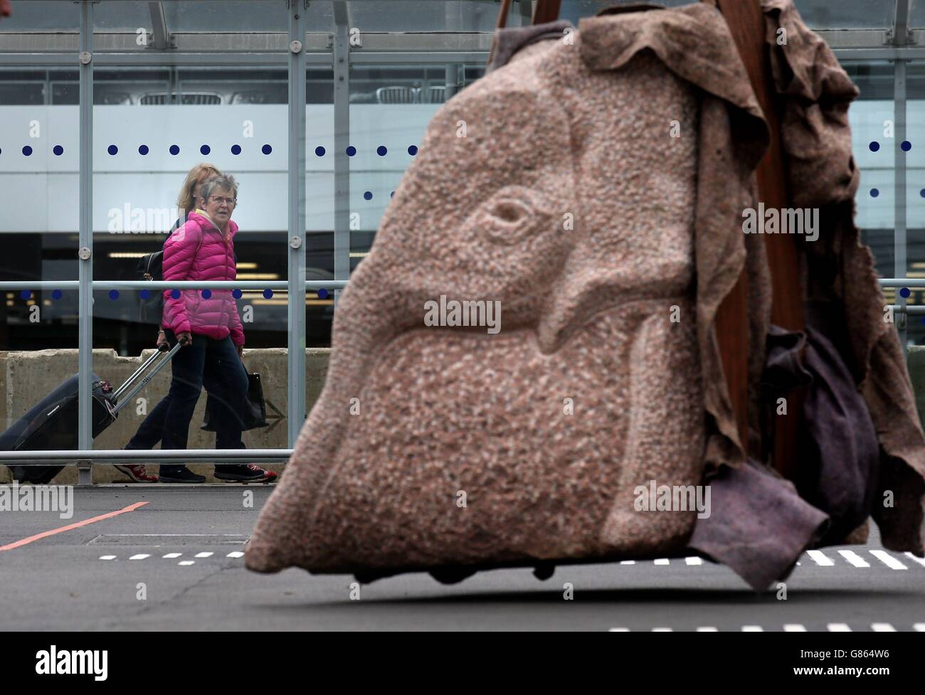 Elephant sculpture at Edinburgh Airport. People watch a 3 ton baby ...