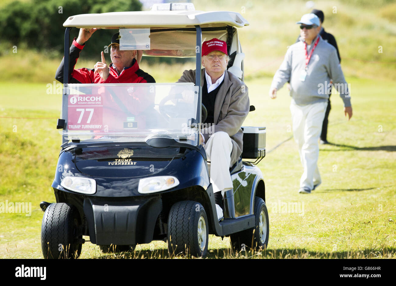 Donald Trump (right) in a golf buggy at his Trump Turnberry golf course ...
