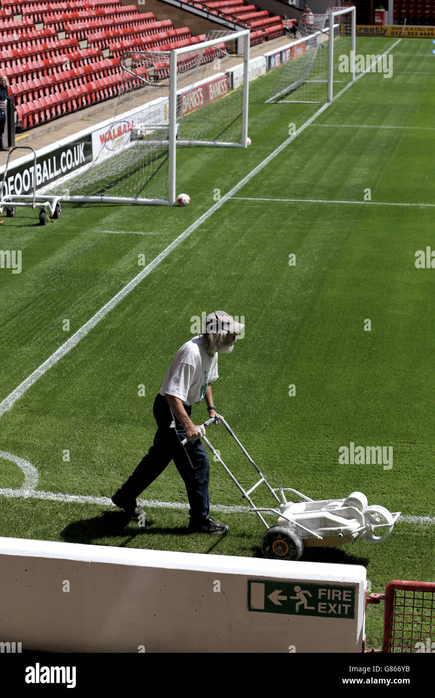 A general view of a groundsman painting the touchlines at the Bank's ...