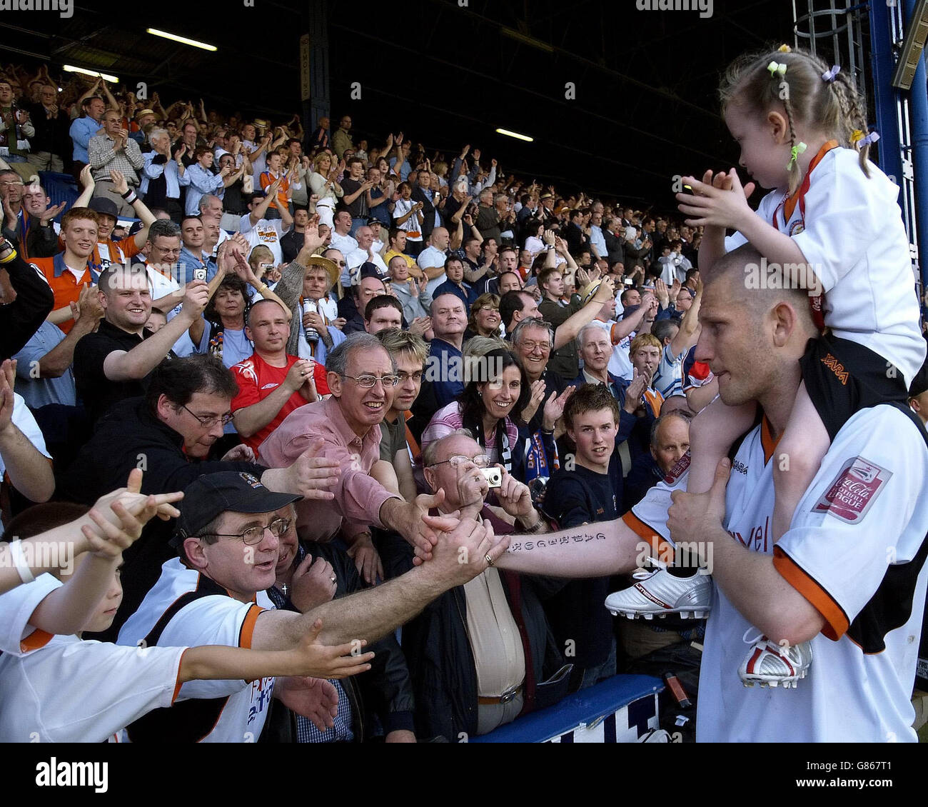 Luton's captain Kevin Nicholls (R) with his daughter Kylie, celebrate ...