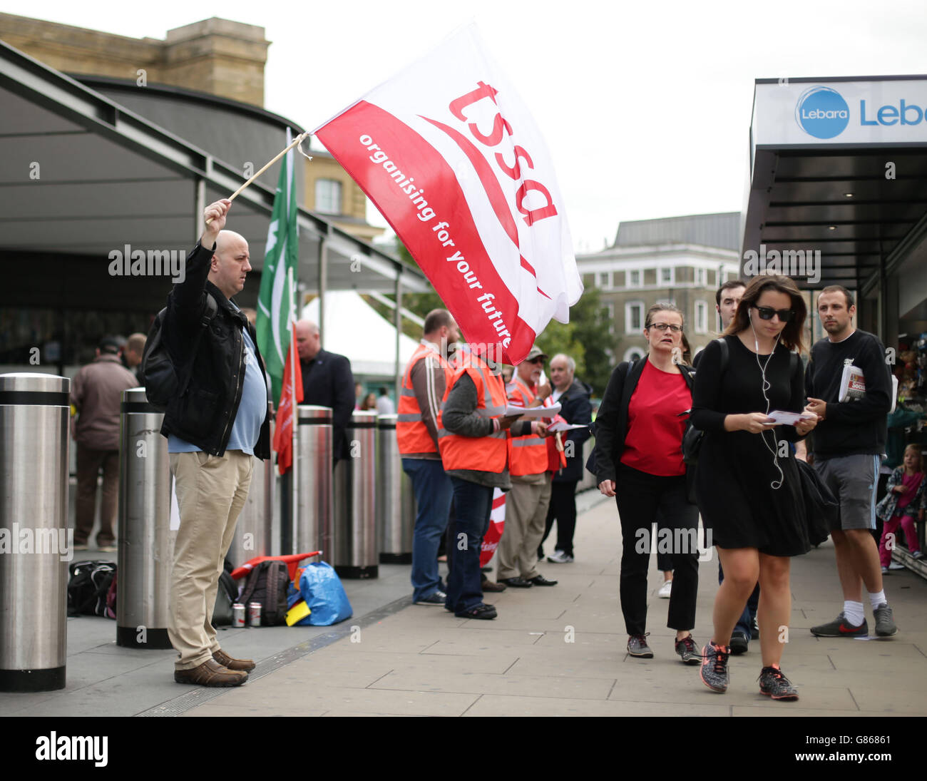 A member of the tssa union picketing outside King's Cross station ...