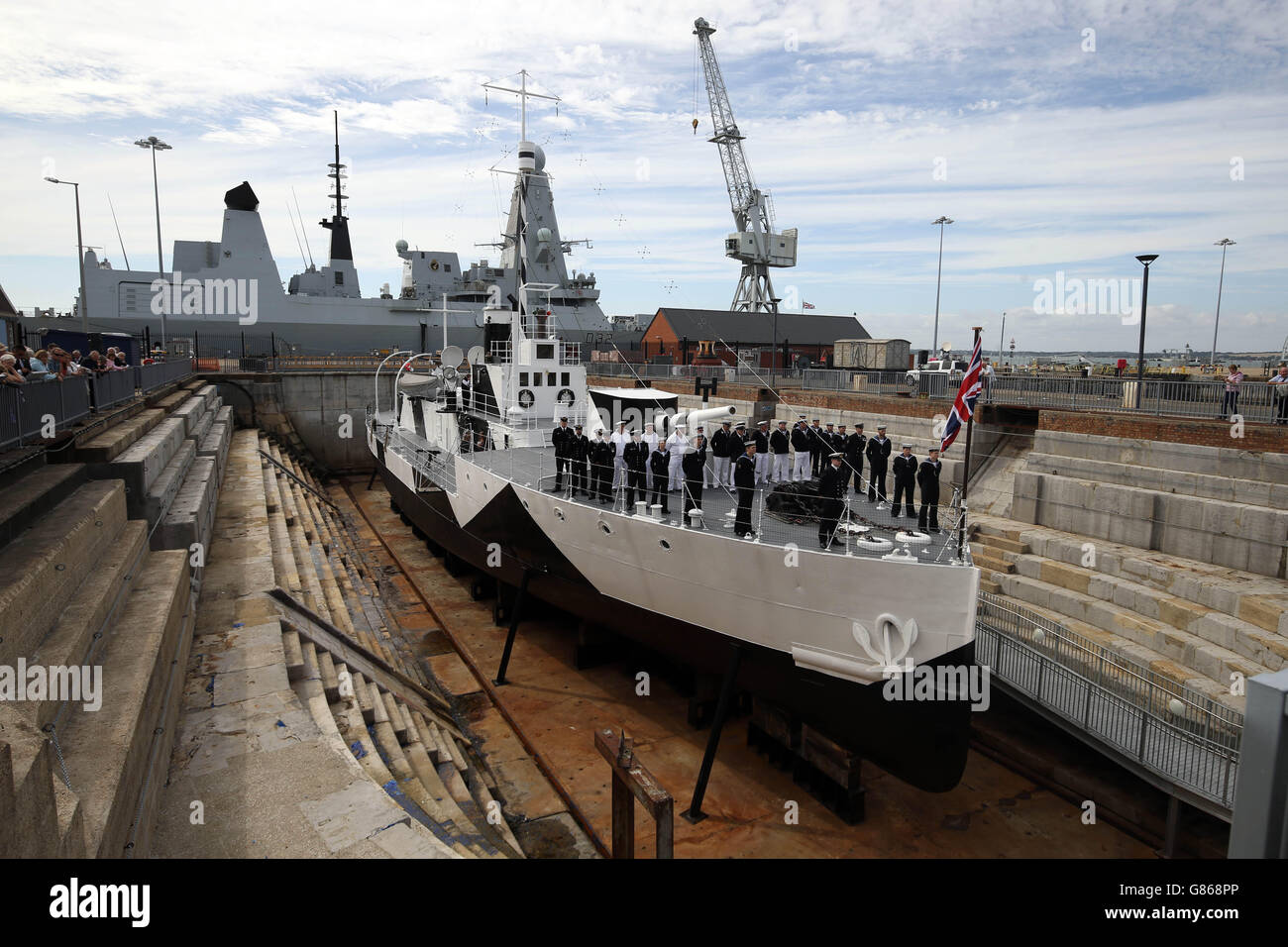 People stand on the deck of HMS M.33, the last surviving Royal Navy ...