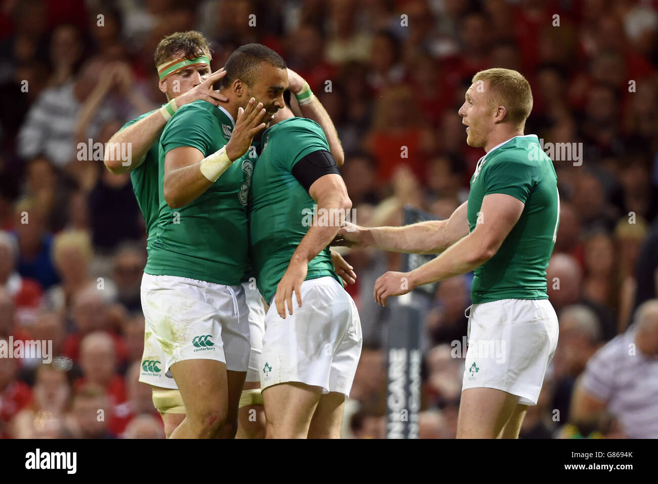 Ireland's Flex Jones (centre) celebrates his try with Simon Zebo (left ...