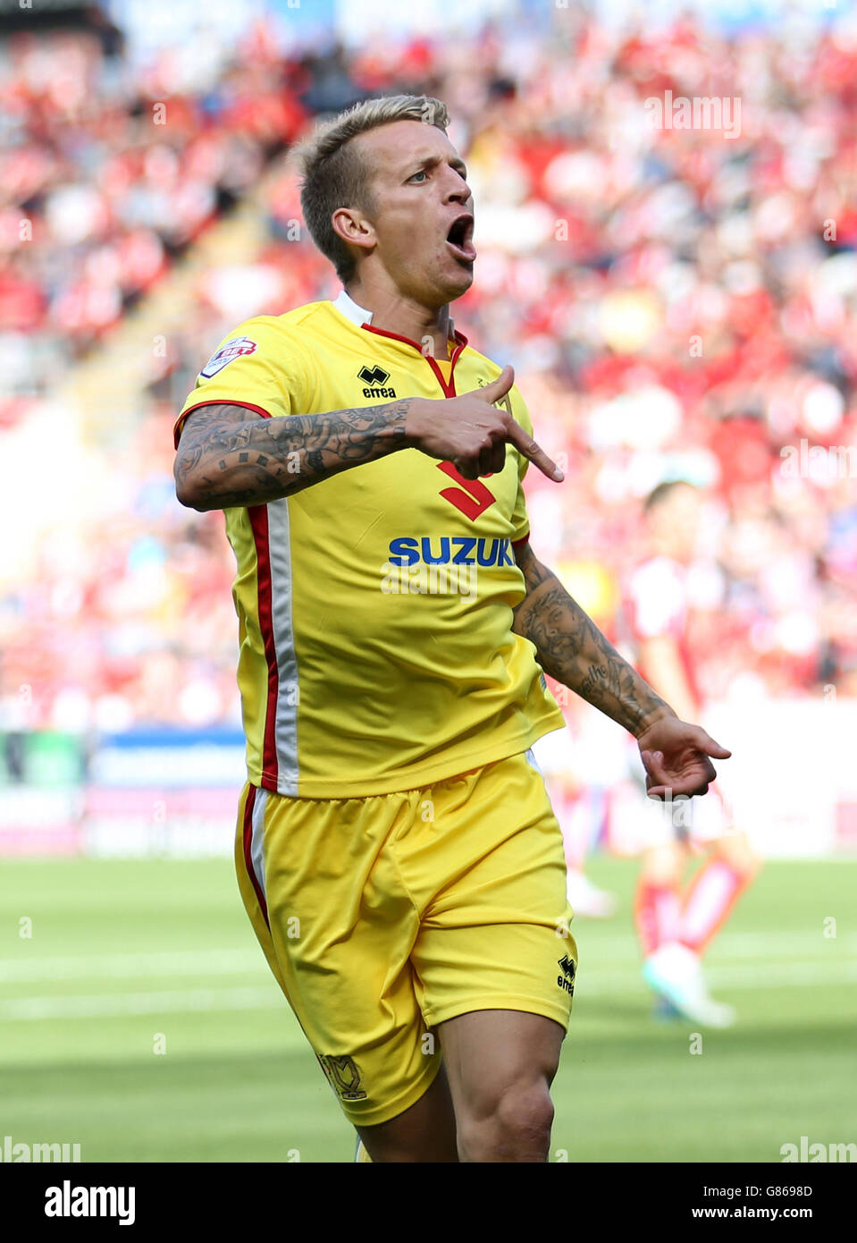MK Dons' Carl Baker celebrates scoring his teams fourth goal of the ...