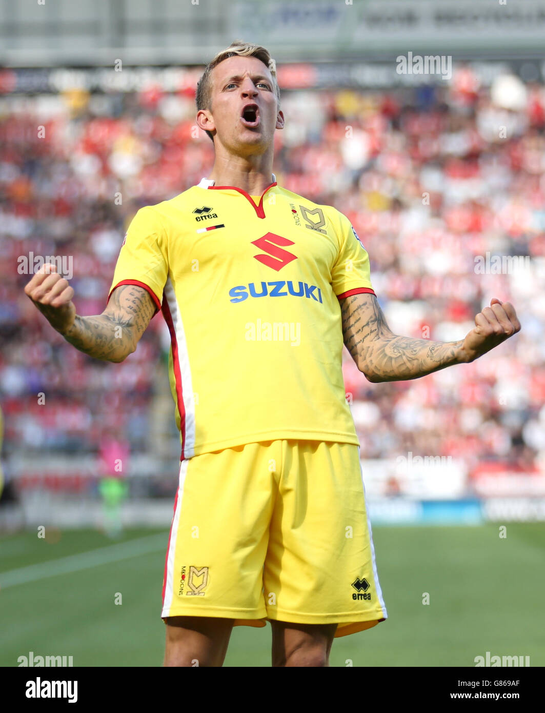 MK Dons' Carl Baker celebrates scoring his teams fourth goal of the ...