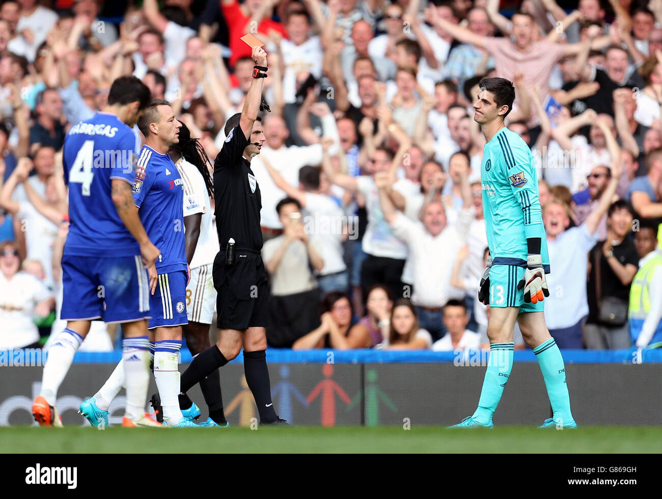 Chelsea goalkeeper Thibaut Courtois is shown a red card after bringing ...