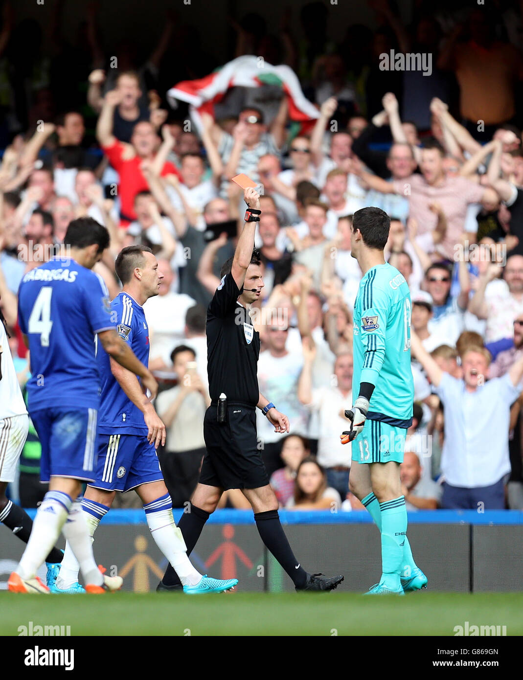 Chelsea goalkeeper Thibaut Courtois is shown a red card after bringing ...
