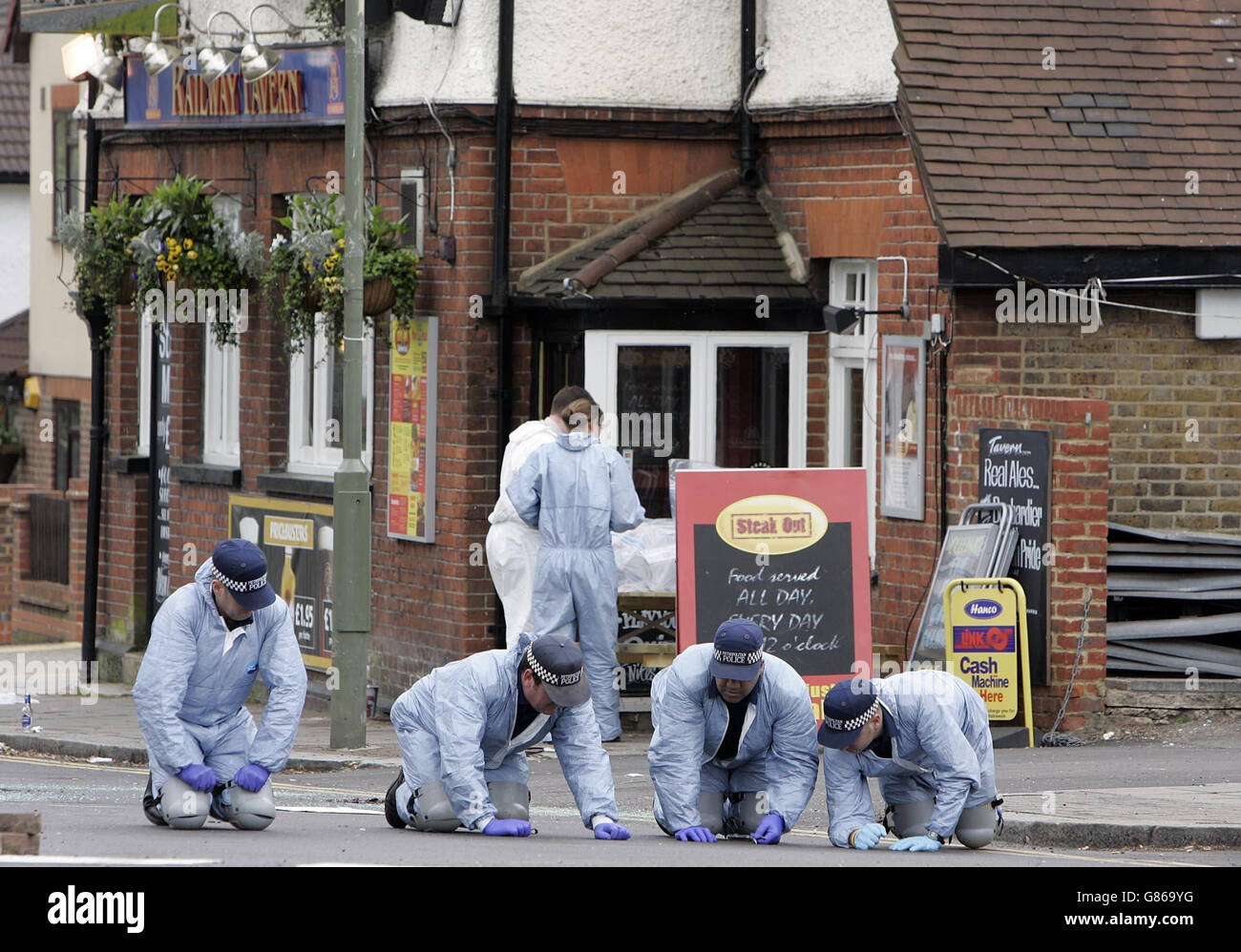 Police Forensics team outside The Railway Tavern at the scene where ...