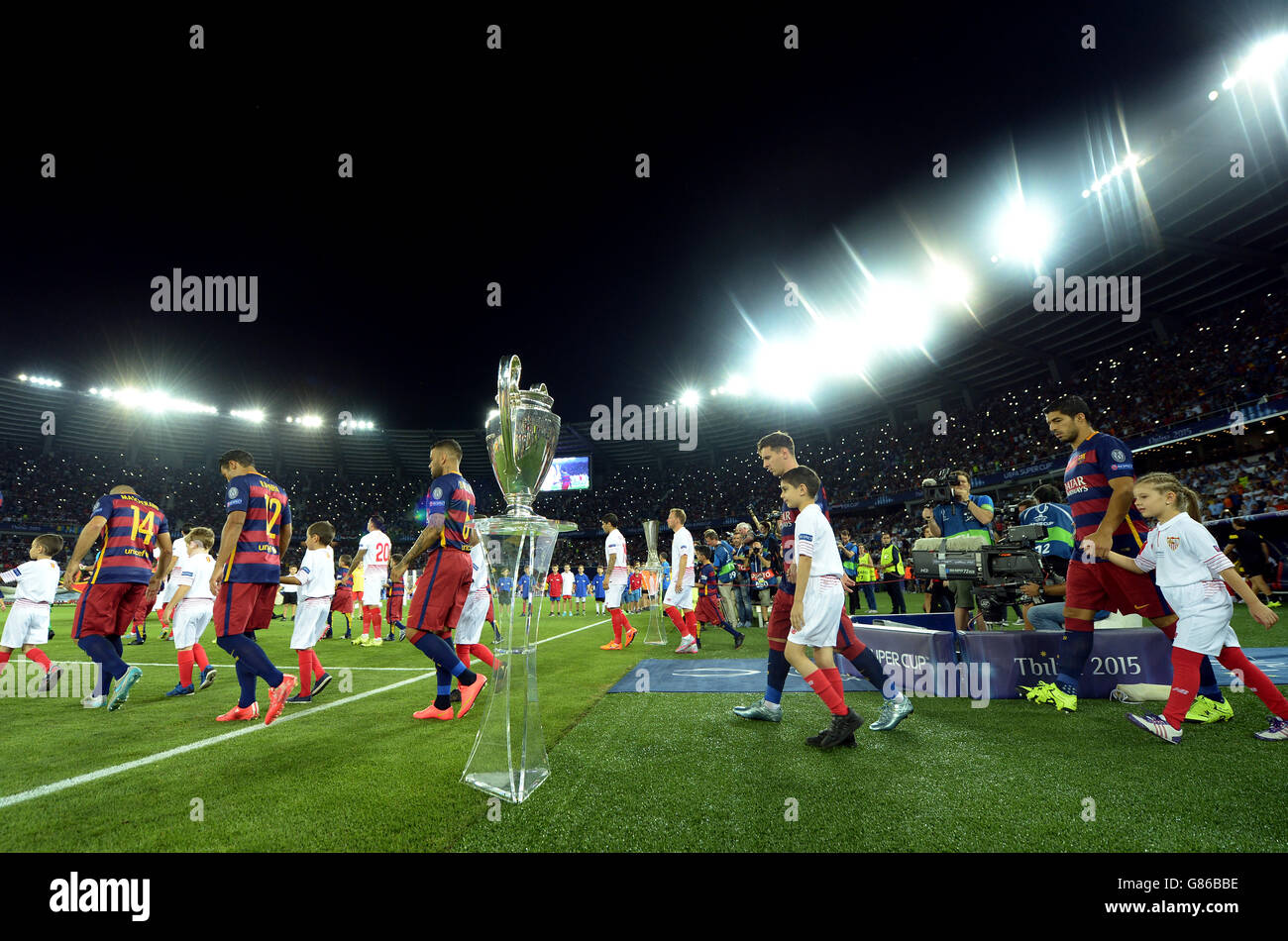 Barcelona's Lionel Messi and Luis Suarez (right) walk out before the ...