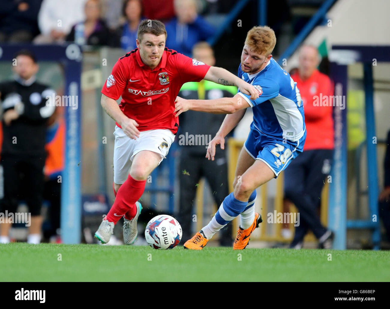 Rochdale's Callum Camps (right) challenges Coventry City's John Fleck ...