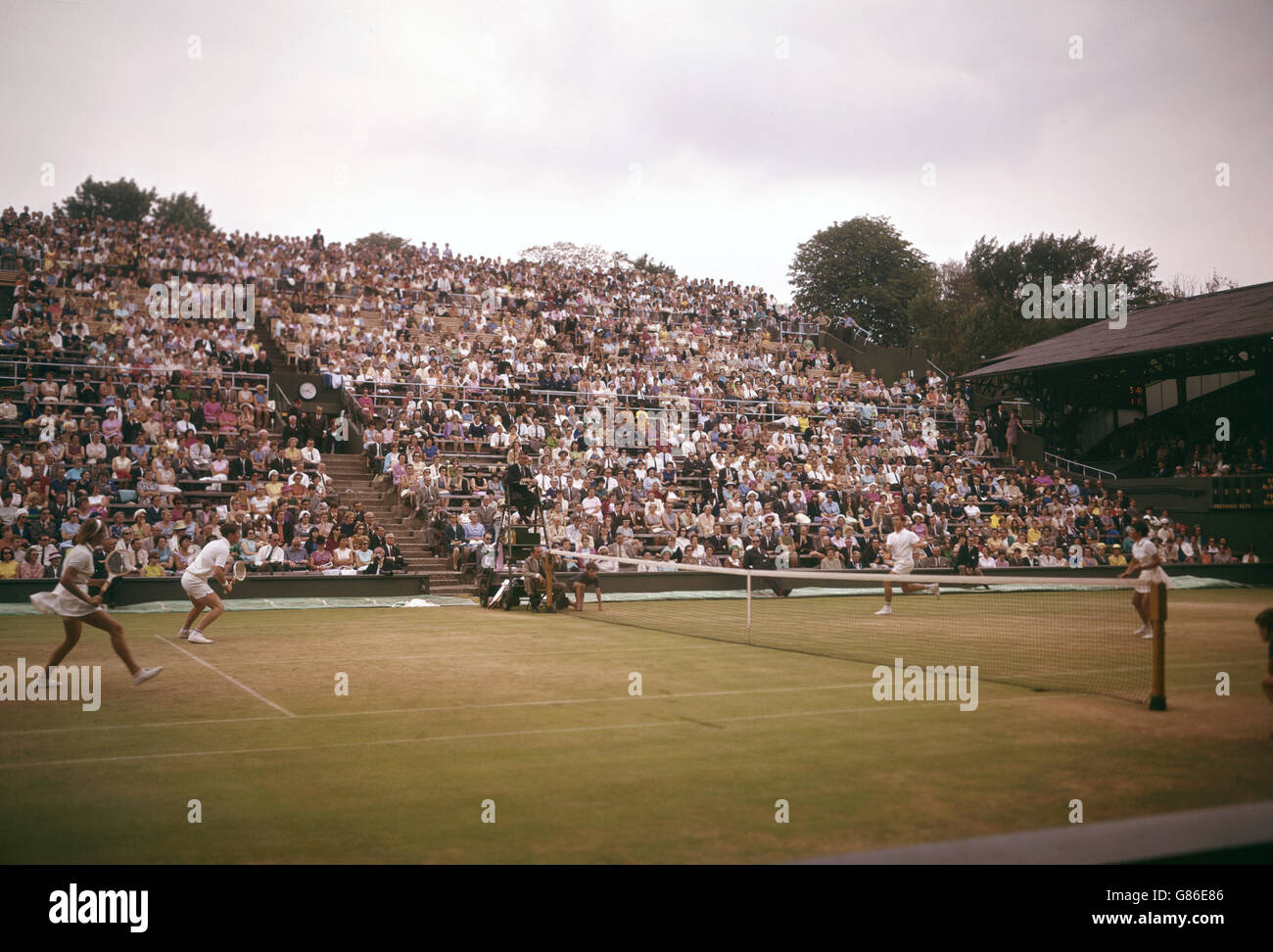 Action from the mixed doubles match between Bob Lutz and Rosie Casals ...