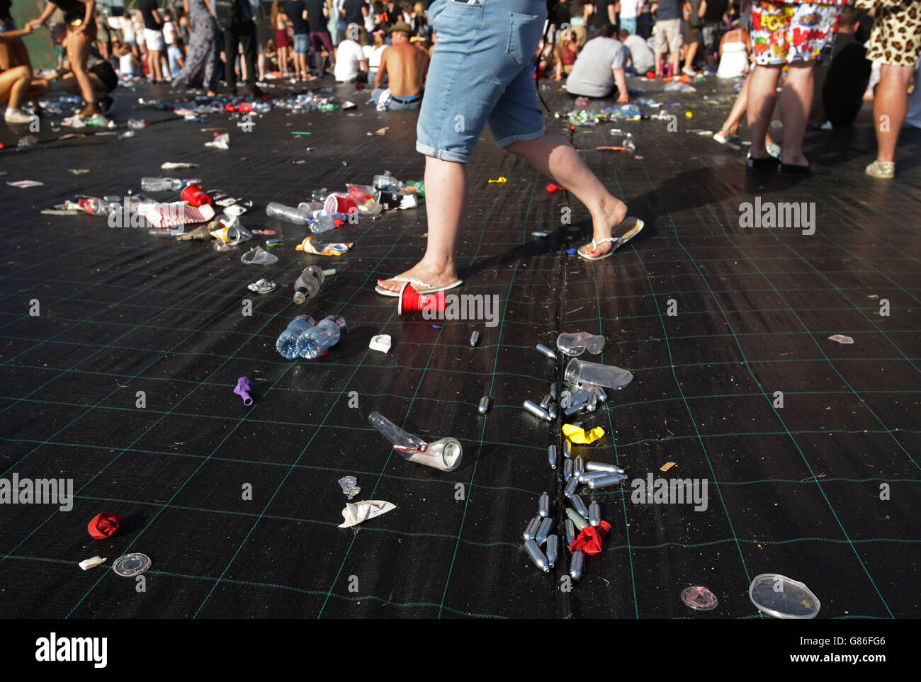 Discarded balloons and nitrous oxide canisters in front of the Virgin ...