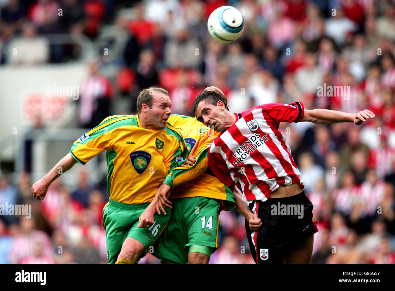 Norwich City's Simon Charlton heads towards goal under pressure from ...
