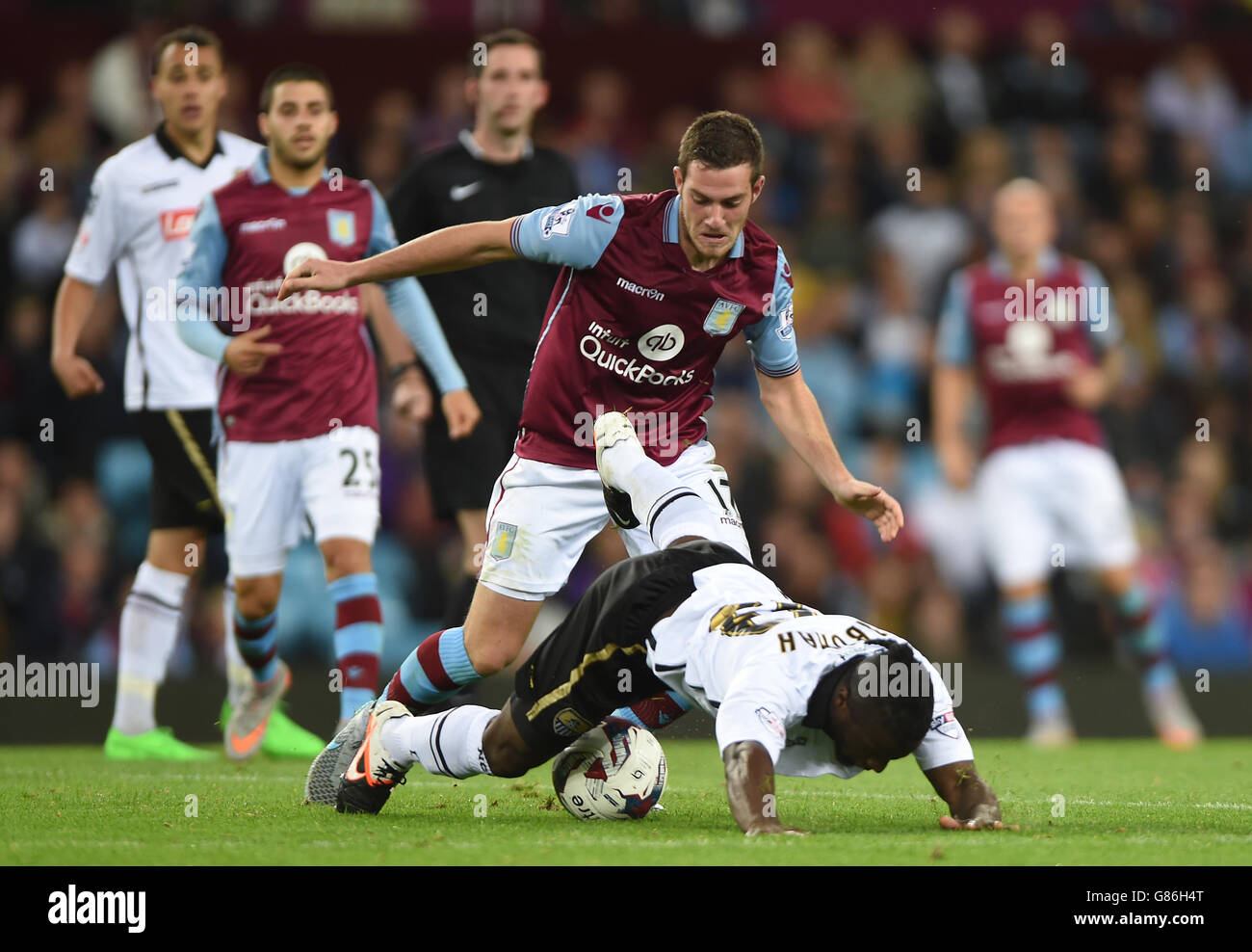 Notts County's Stanley Aborah is fouled by Aston Villa's Jordan ...