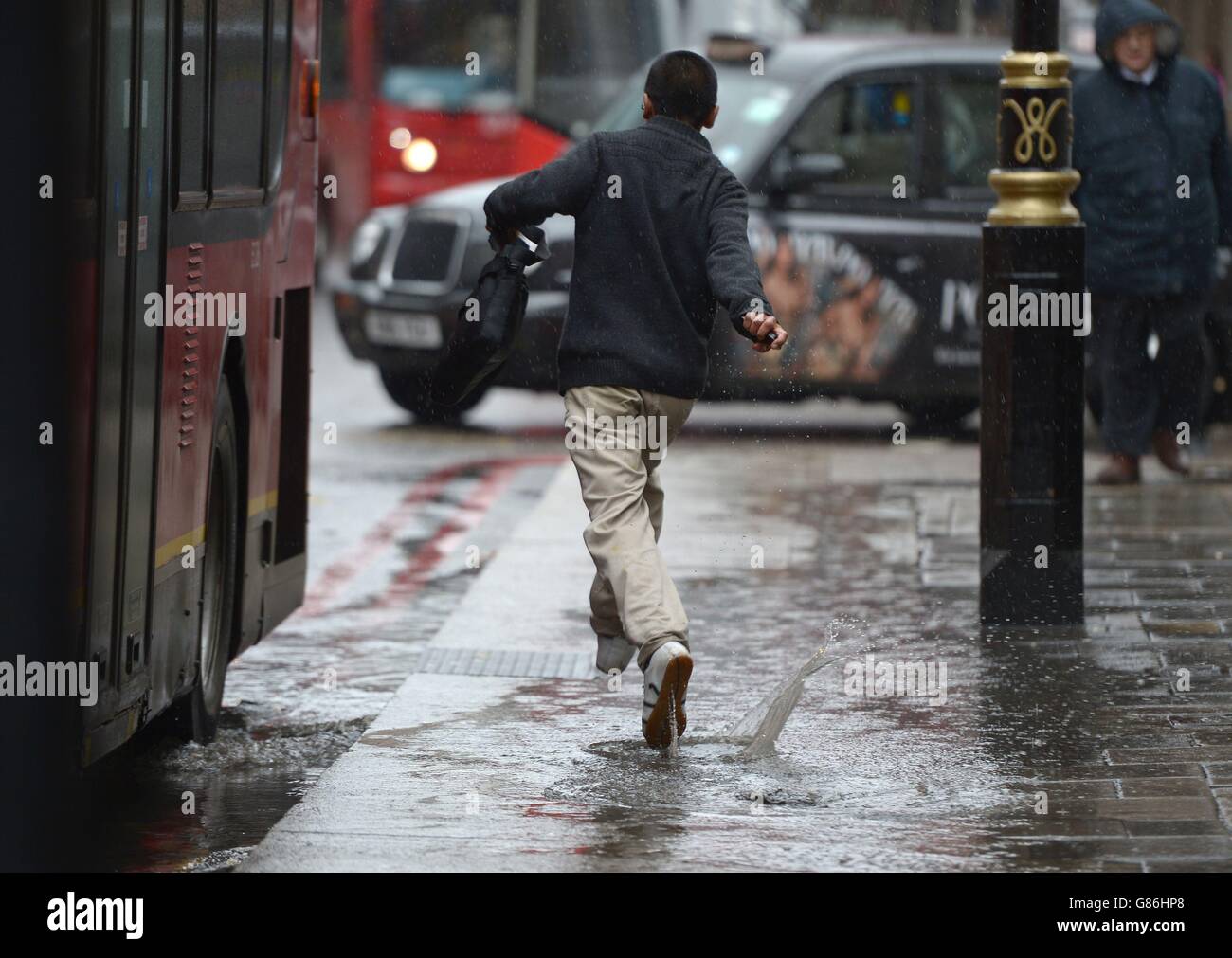 Members public get caught in heavy rain in central london hi-res stock ...