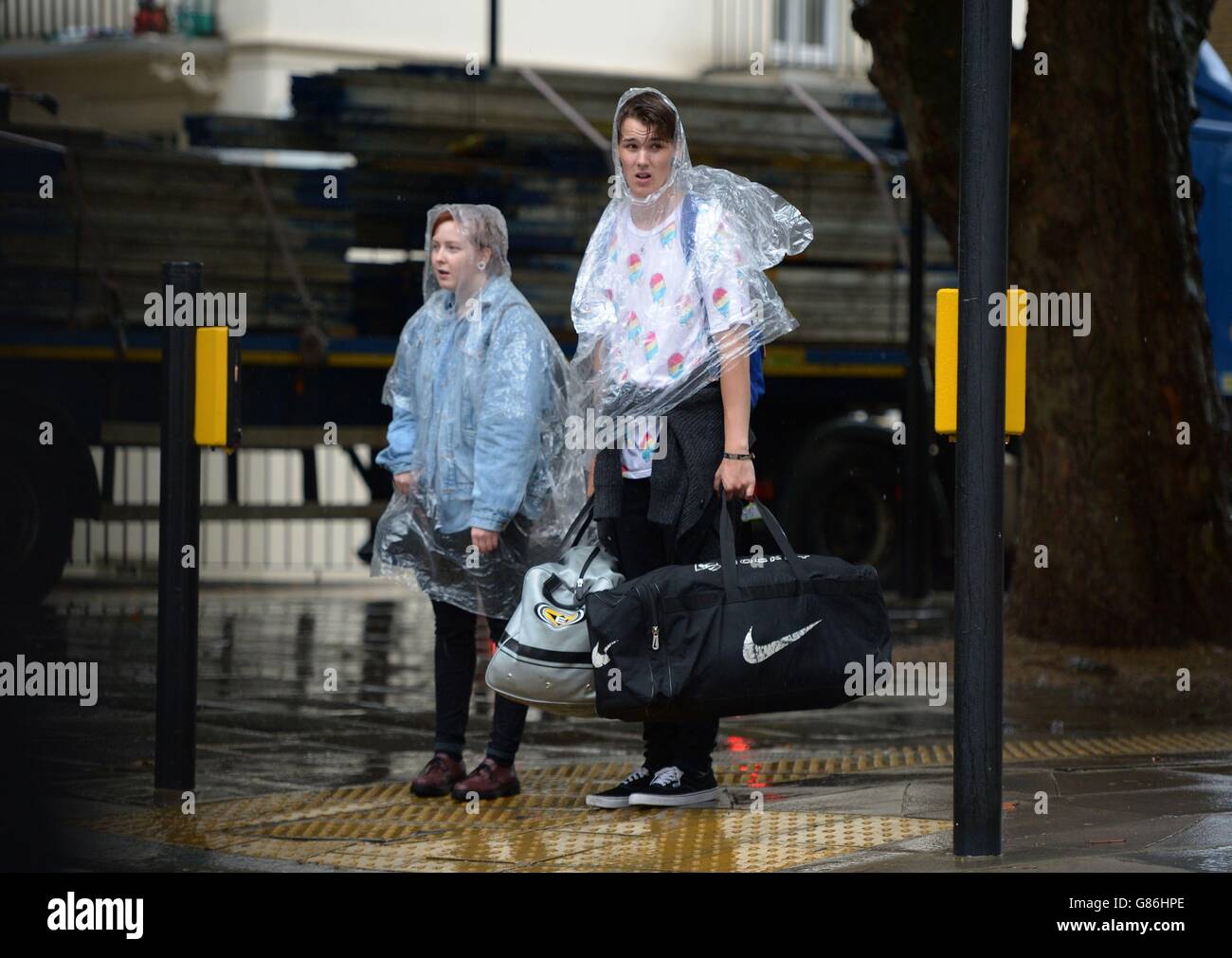 Members public get caught in heavy rain in central london hi-res stock ...