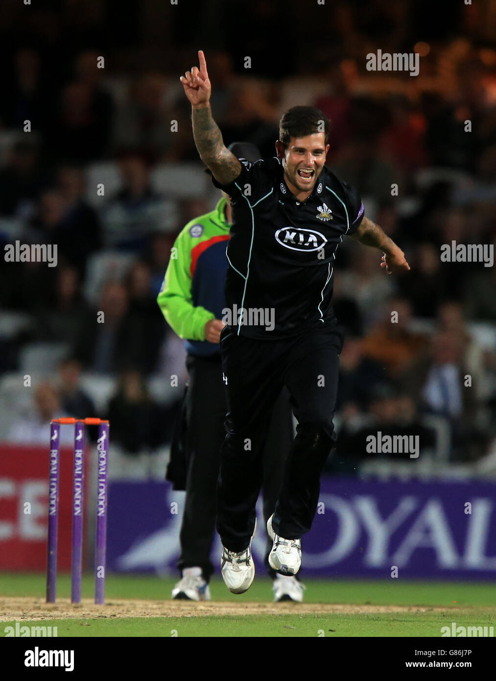 Surrey's Jade Dernbach celebrates taking the wicket of Kent's Mitchell ...
