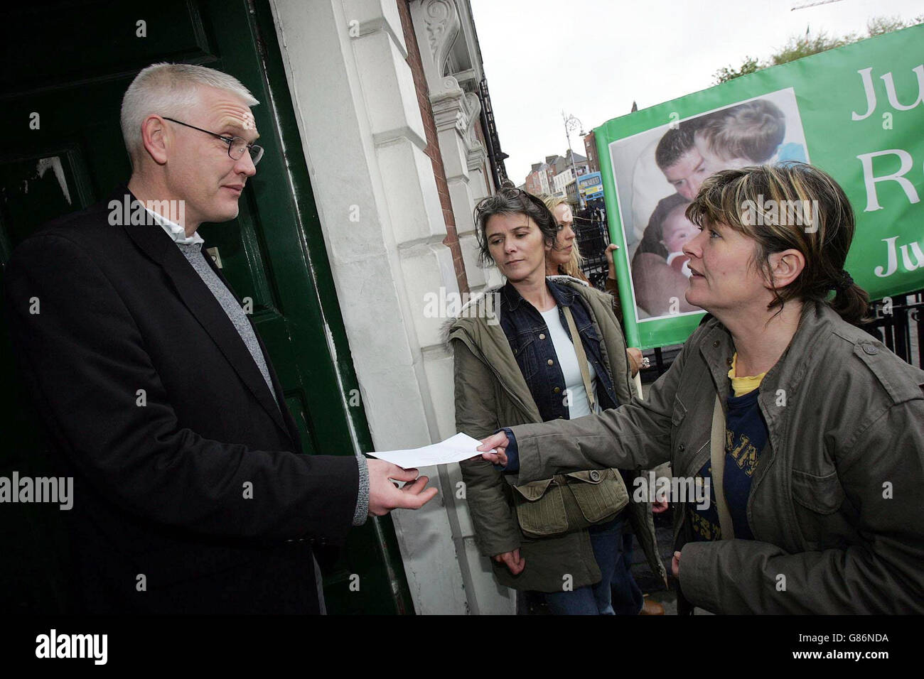 Paula McCartney (right) hands over a letter outlining their concerns to ...