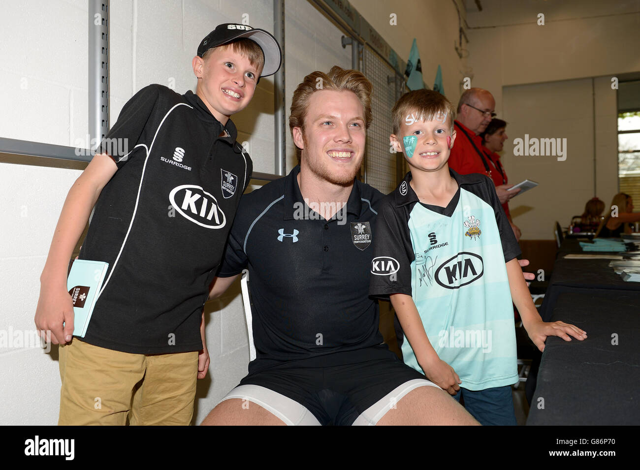 Surrey's Matt Dunn poses for a picture with fans during the Family Day ...