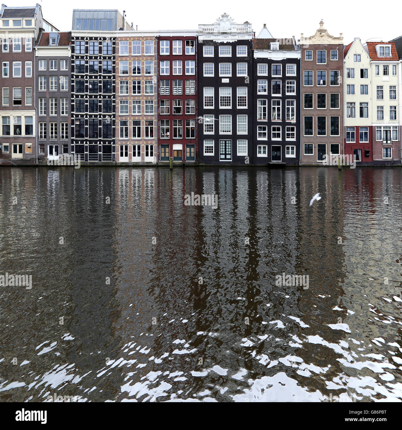 Houses in a row along canal, Amsterdam, Holland Stock Photo - Alamy