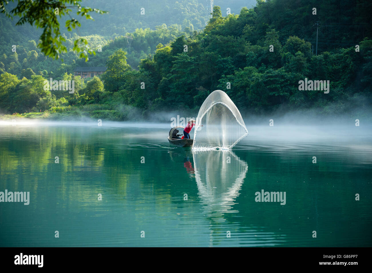 Man in boat throwing fishing net, Chenzhou, Hunan, China Stock Photo ...