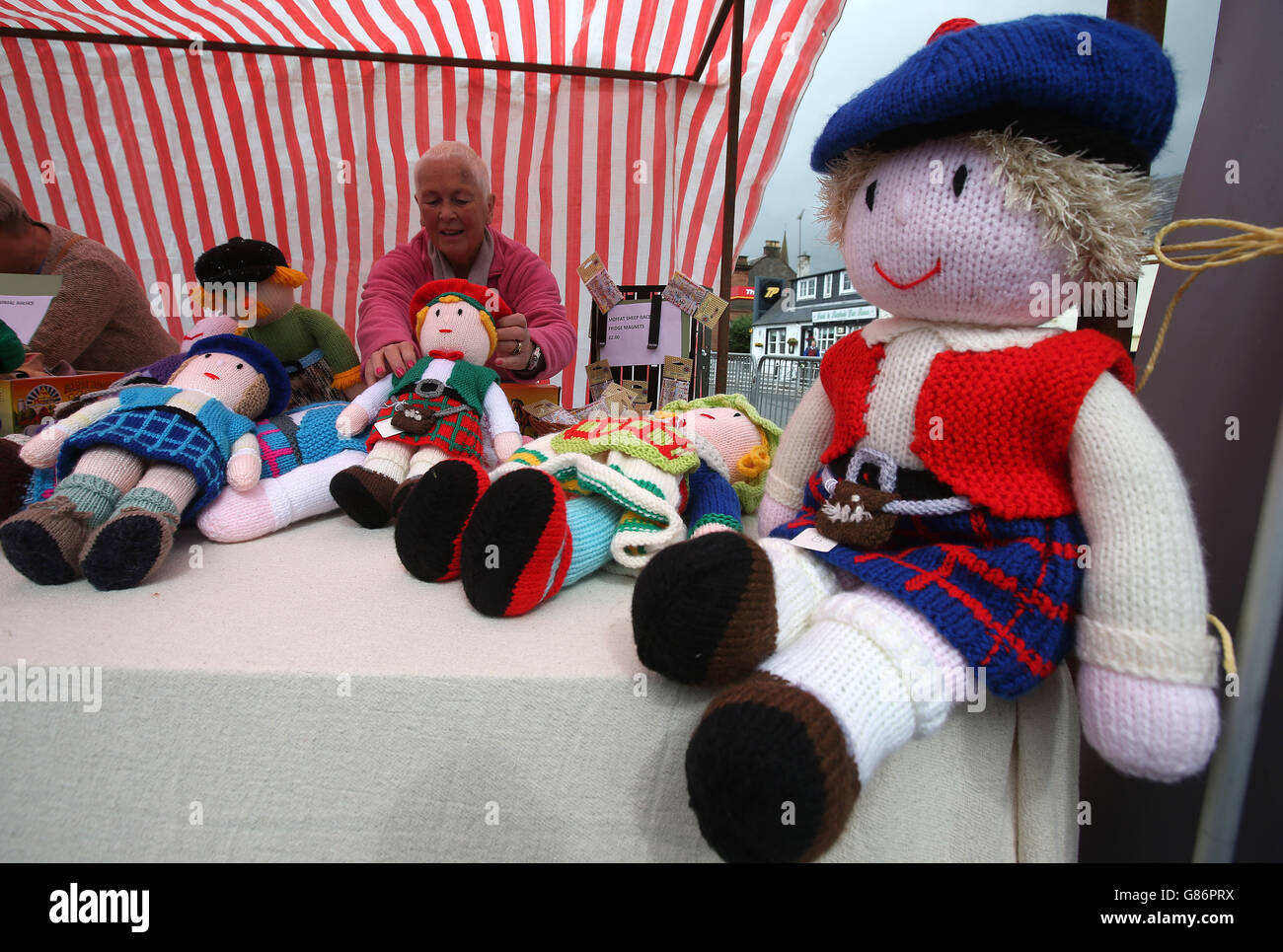 Audrey Sherwin at a stall with knitted woollen jockeys as sheep prepare ...