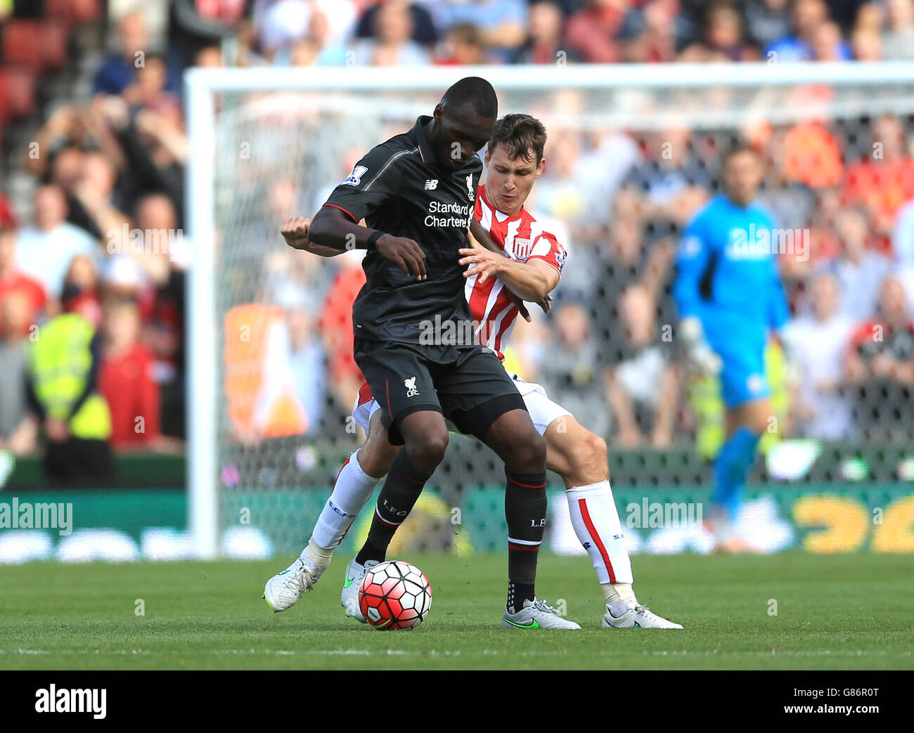 Stoke City's Philipp Wollscheid (right) and Liverpool's Christian ...