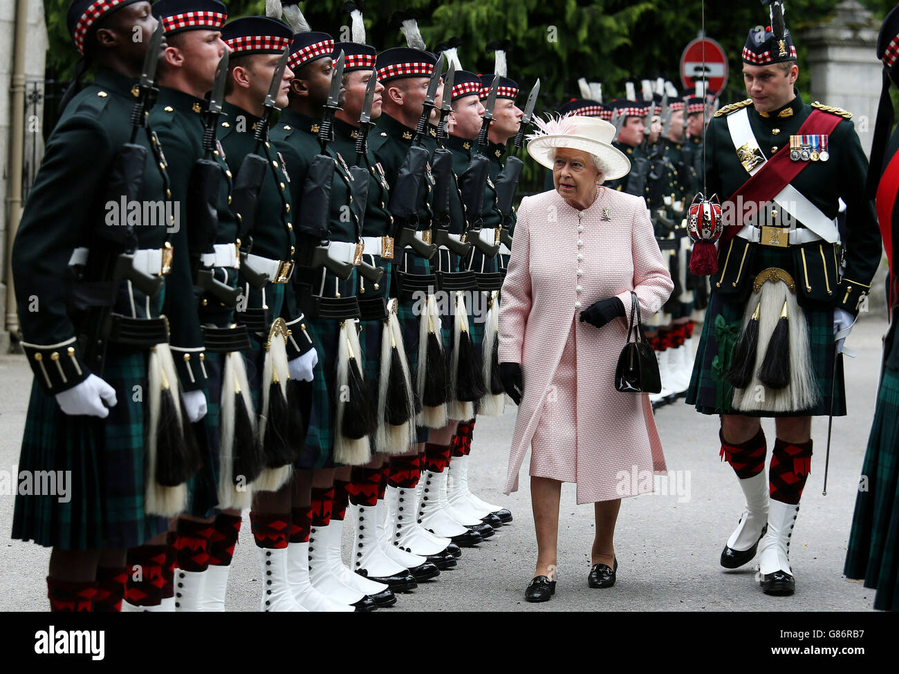 Queen Elizabeth II with guard commander Major Alastair Colville as she ...