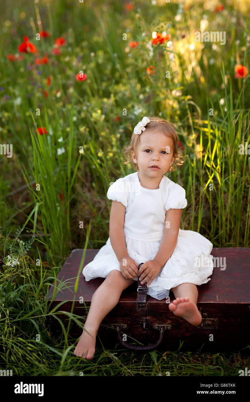Sitting girl with flowers hi-res stock photography and images - Alamy