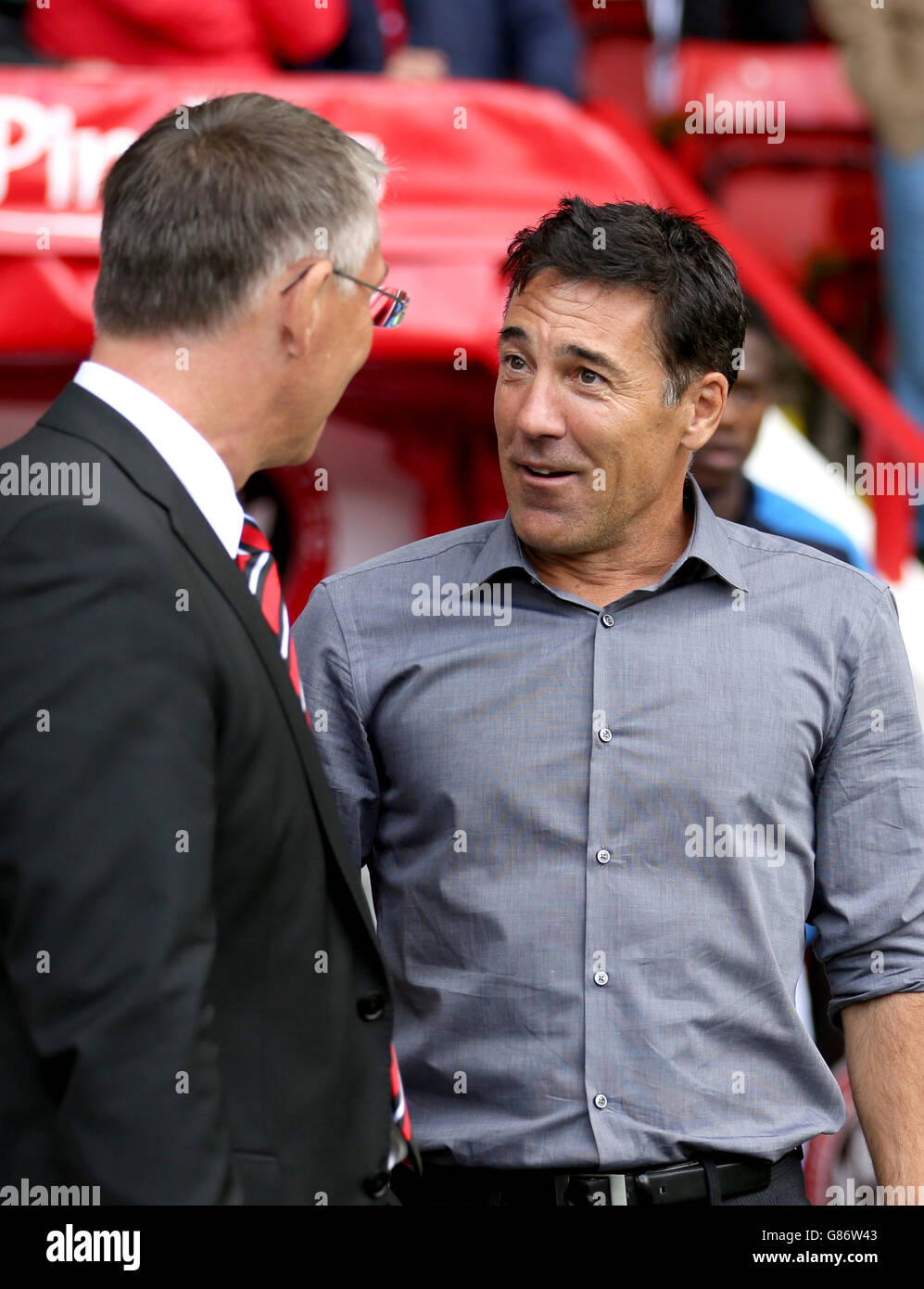 Chesterfield manager Dean Saunders (right) speaks with Sheffield United ...