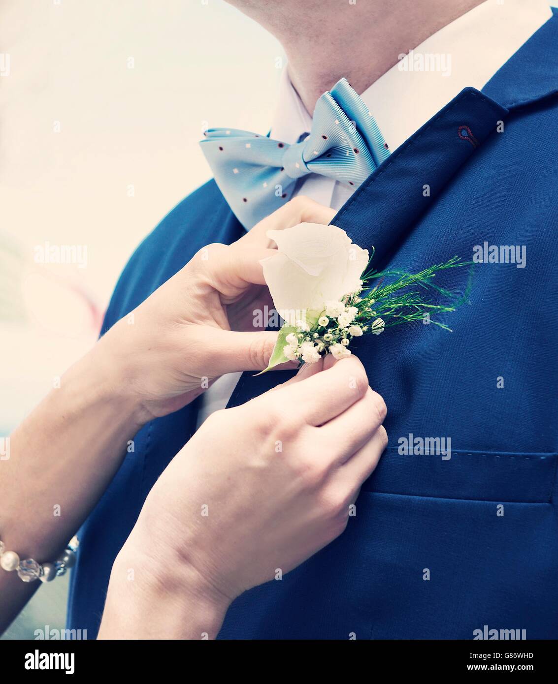 Putting on jacket hi-res stock photography and images - Alamy