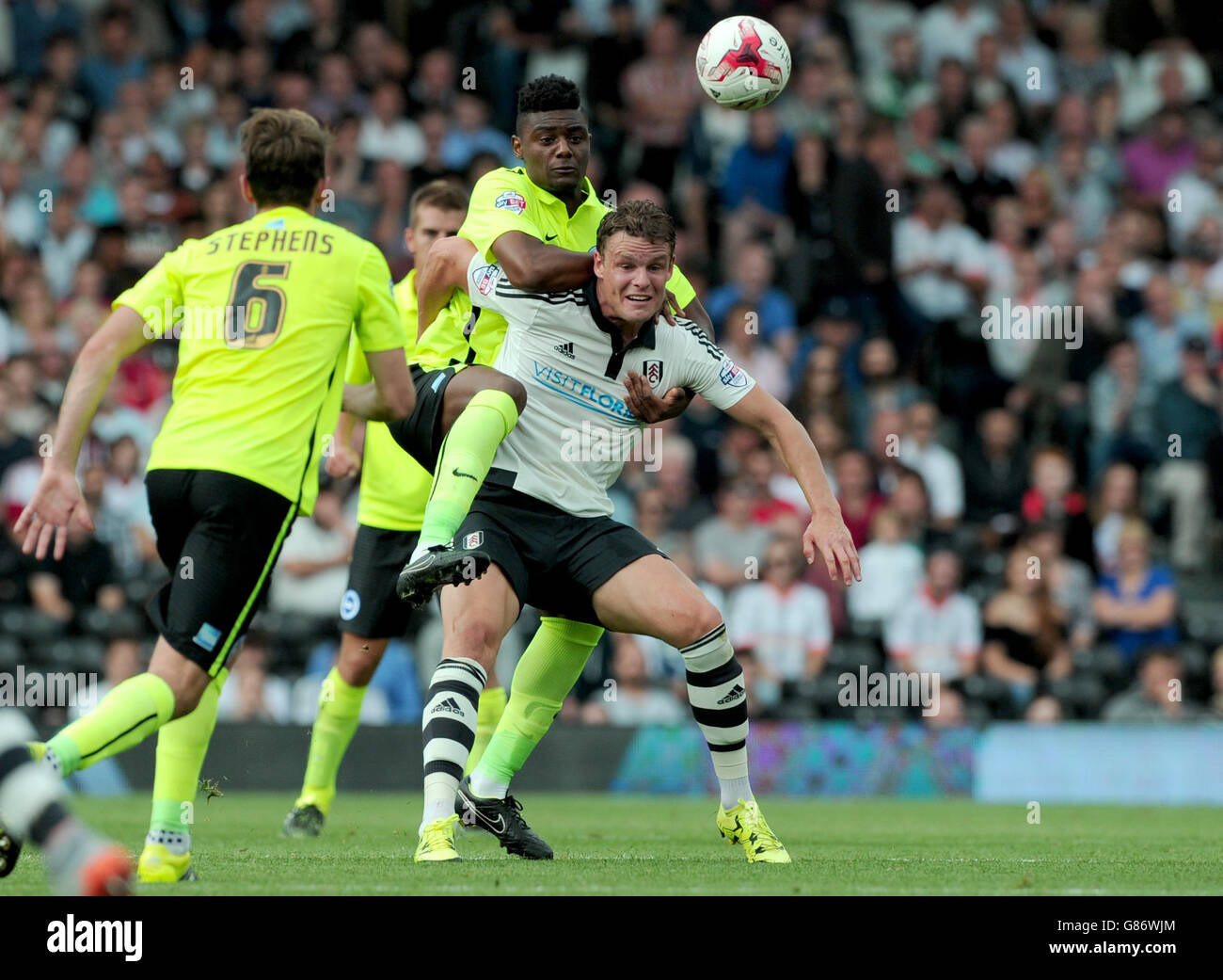 Fulham's Matt Smith (right) and Brighton's Rohan Ince (centre) compete ...