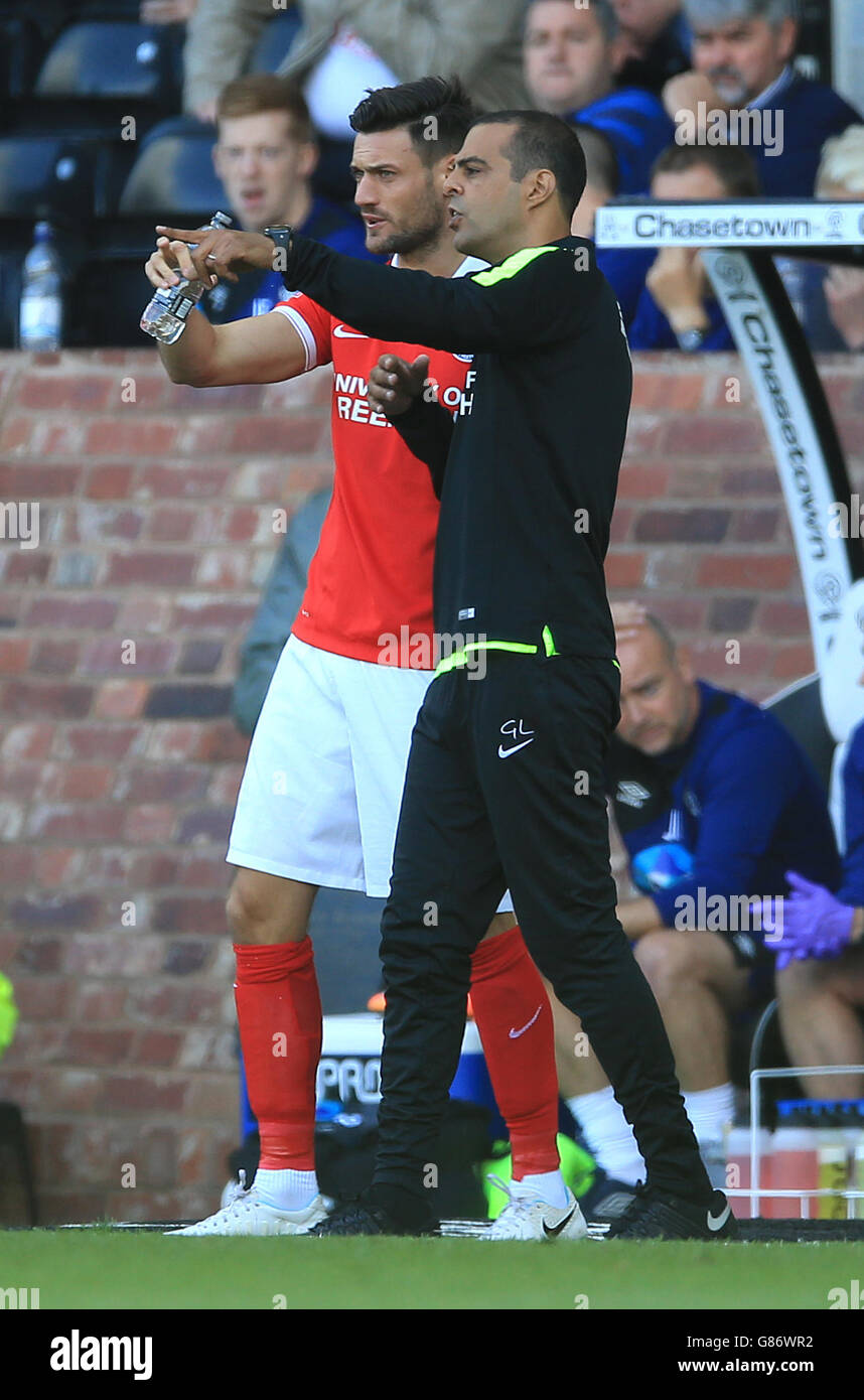 Charlton Athletic manager Guy Luzon (right) talks to Johnnie Jackson ...
