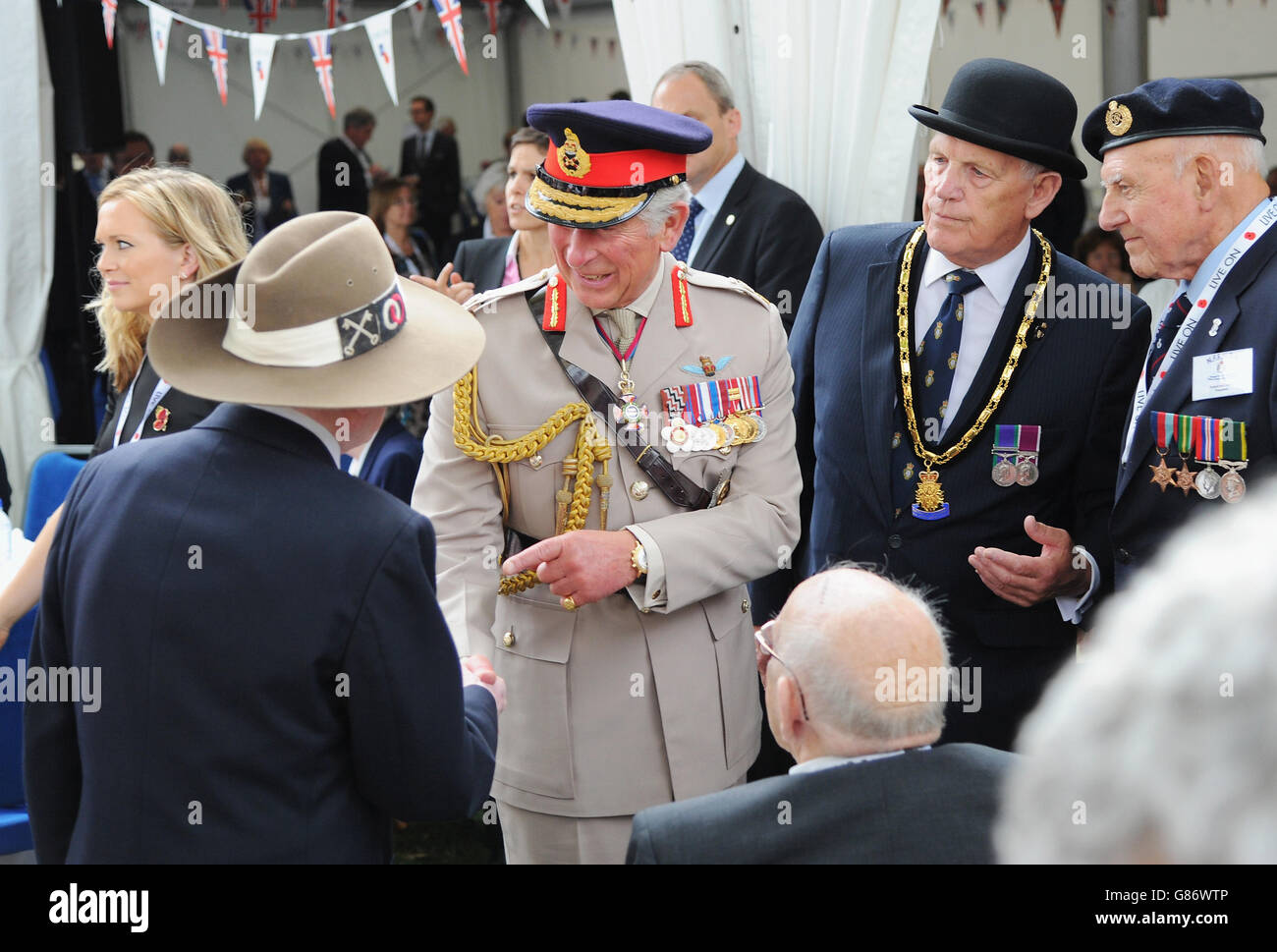 The Prince of Wales meets veteran James Fenton (left) during the 70th ...