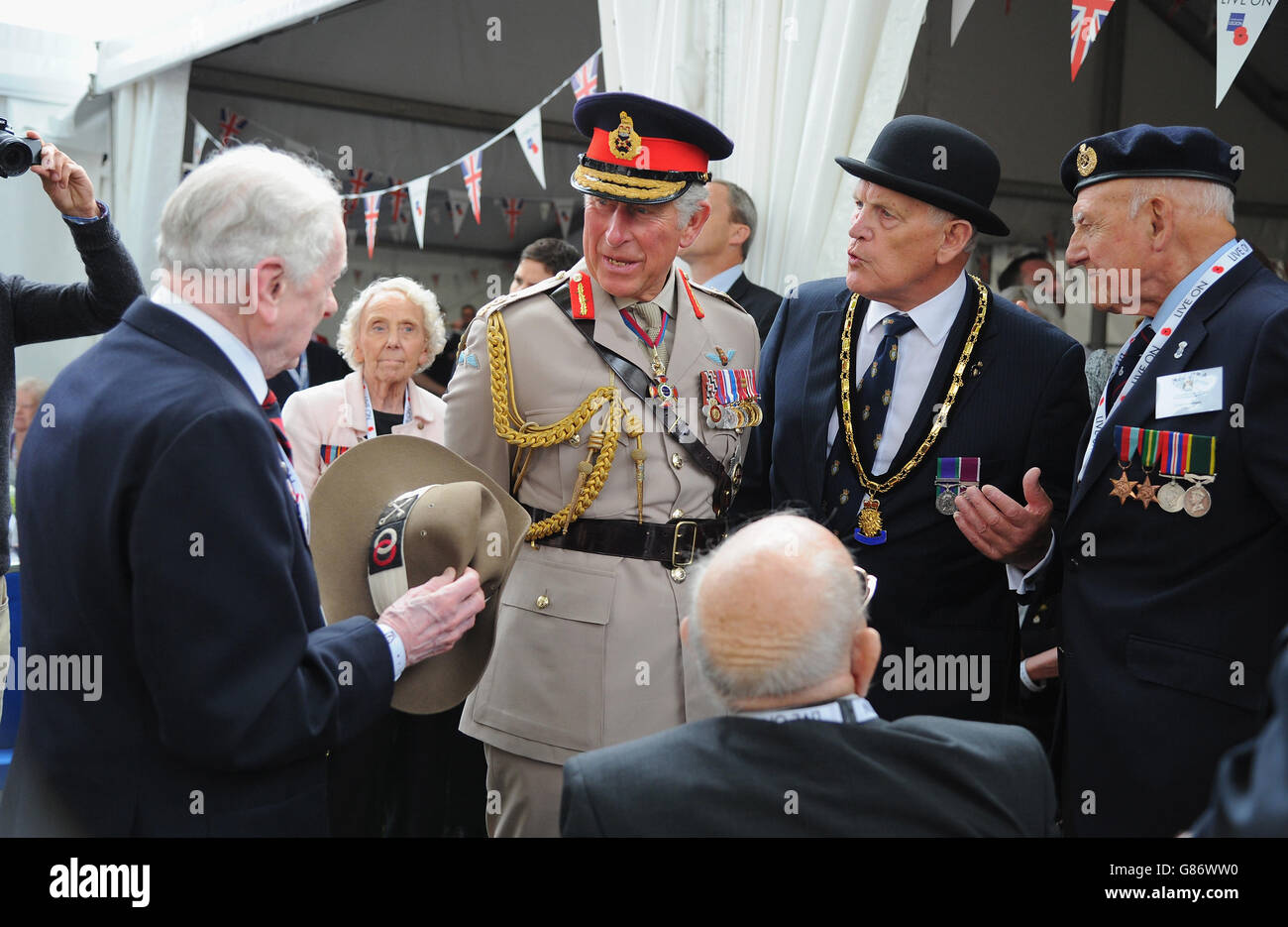 The Prince of Wales meets veteran James Fenton (left) during the 70th ...