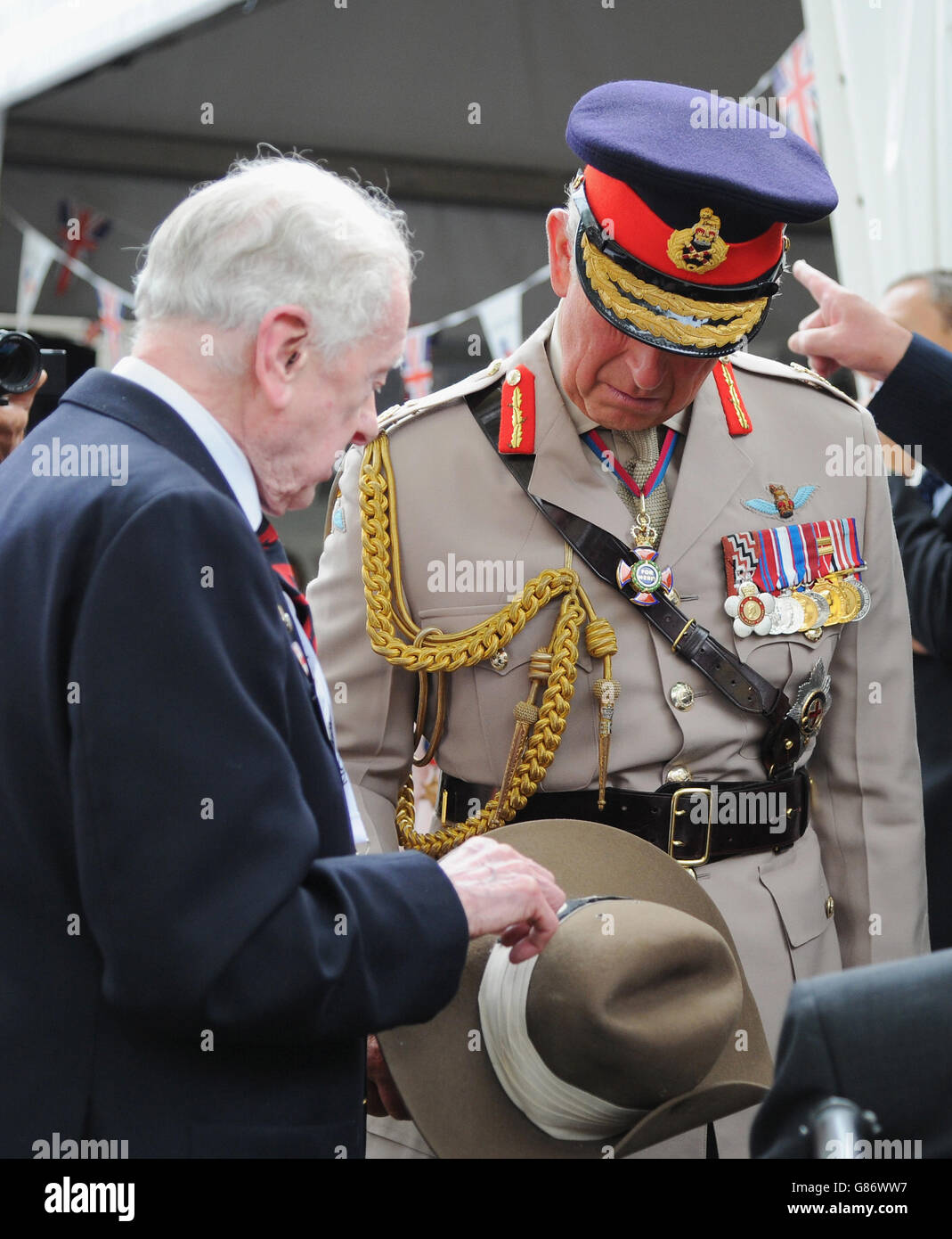 The Prince of Wales meets veteran James Fenton (left) during the 70th ...