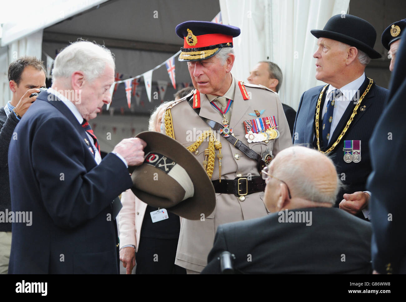The Prince of Wales meets veteran James Fenton (left) during the 70th ...