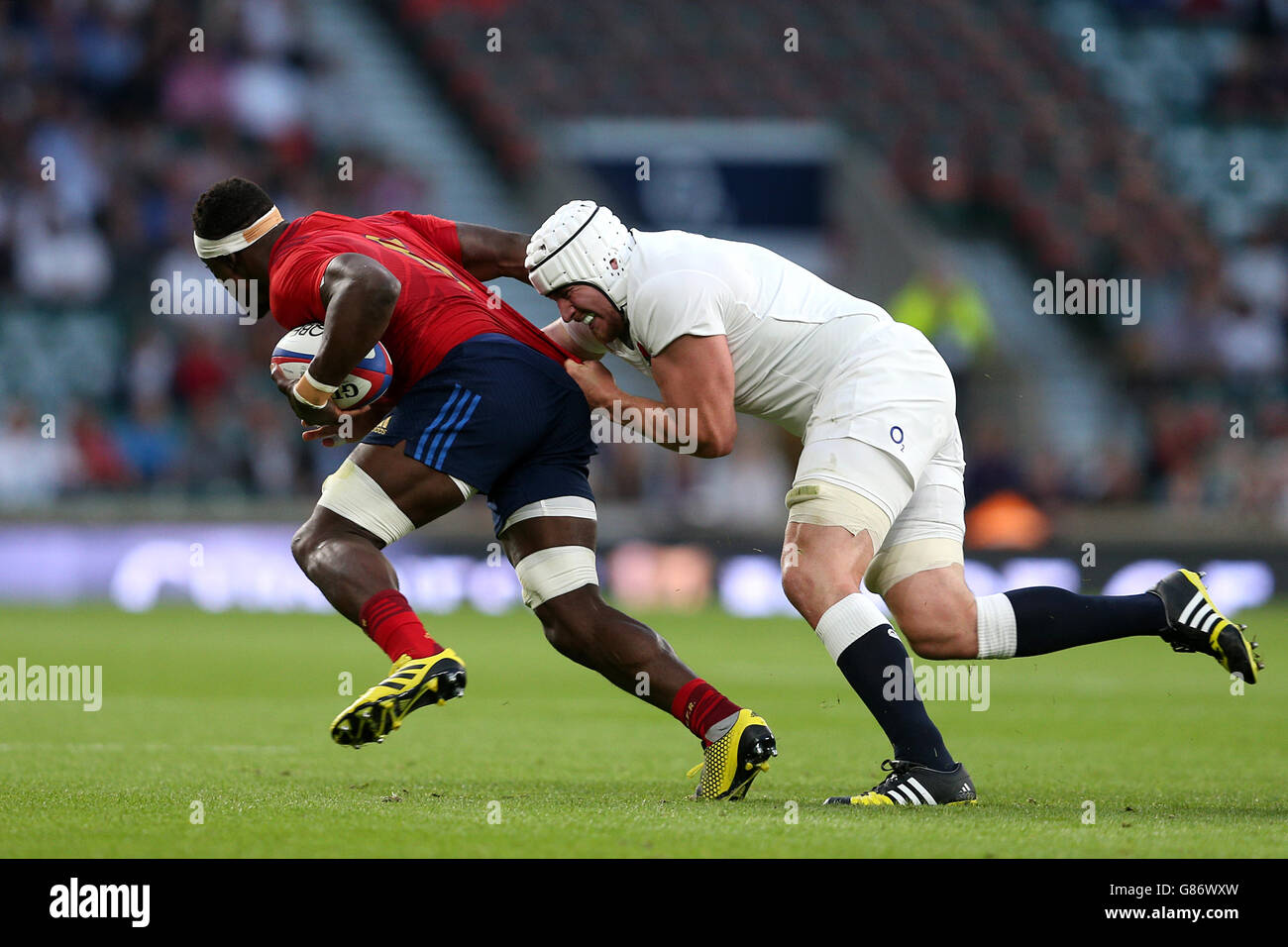 England's Ben Morgan tackles France's Yannick Nyanga Kabasele (left ...