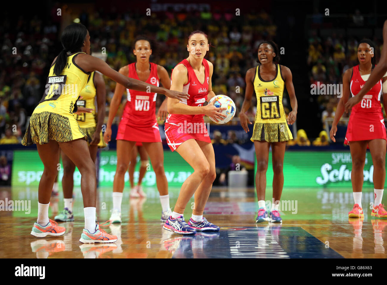 England's Jade Clarke (centre) and Jamaica's Nicole Dixon (left) battle ...