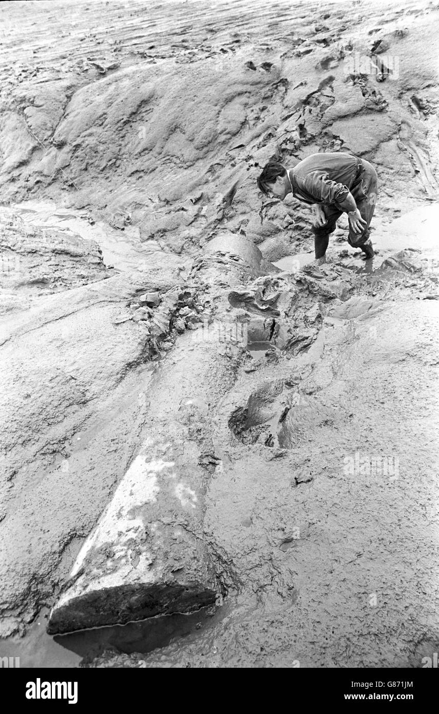 A large, unidentified object, is examined by a Royal Navy explosives ...